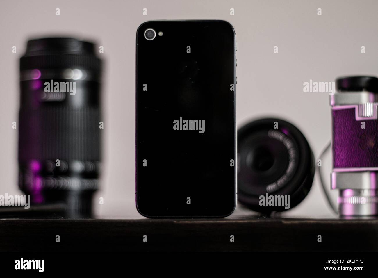 A black mobile phone on the table Stock Photo - Alamy