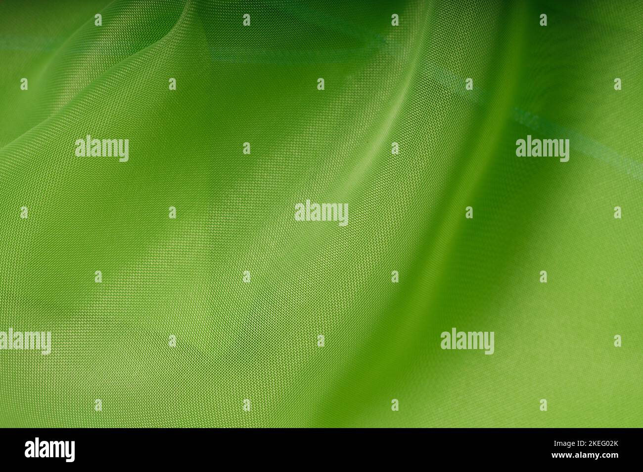 green silk fabric. wavy fabric texture Stock Photo - Alamy
