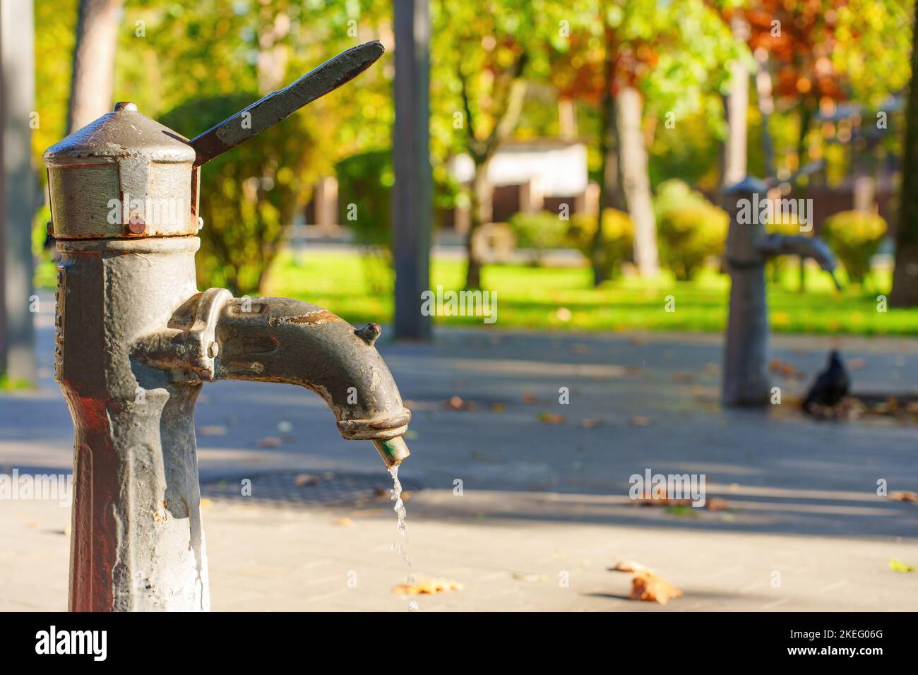 Close-up of a weathered hand pump of the public drinking water ...