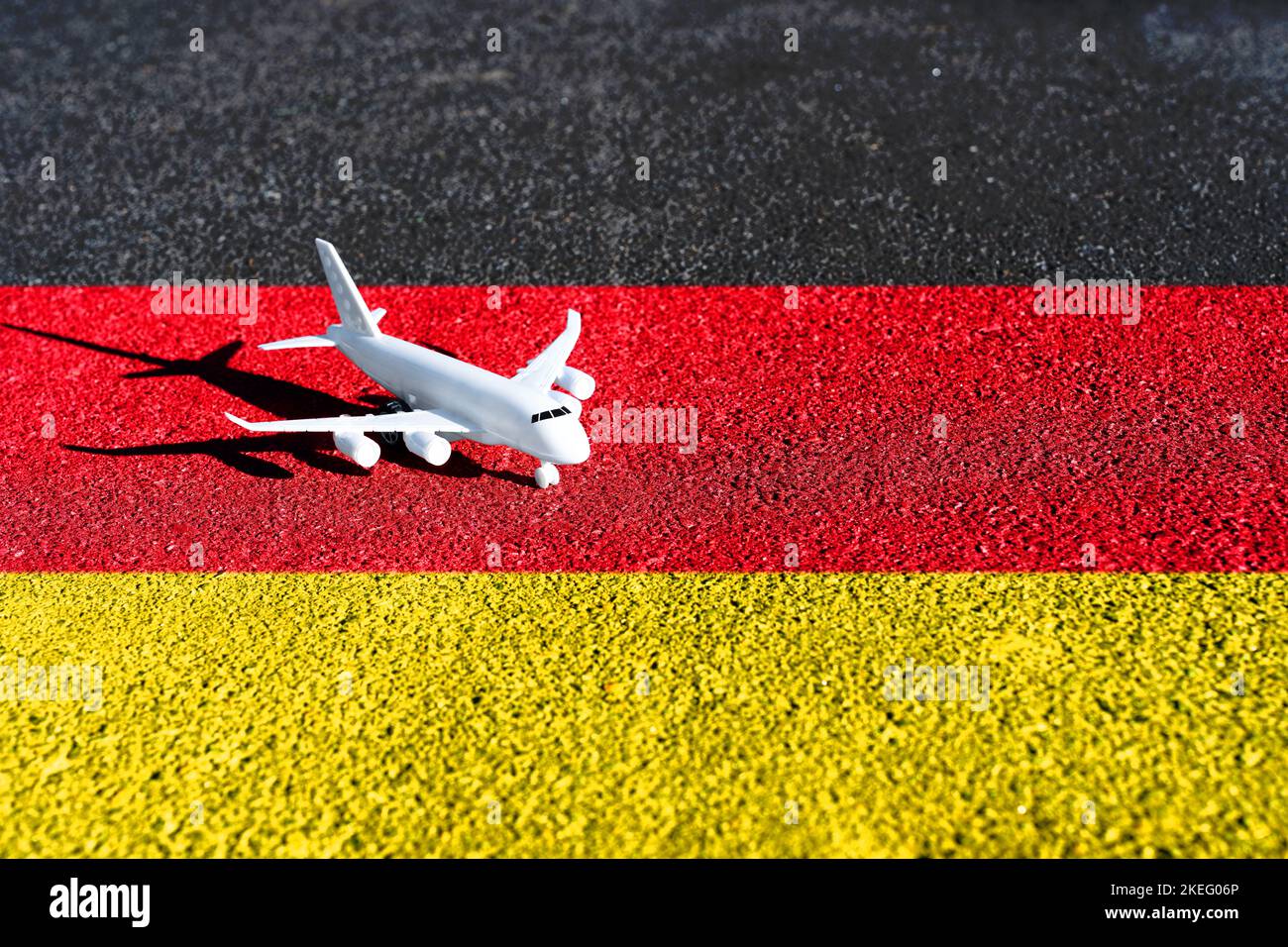 Toy airplane placed on the road painted the colors of the national flag ...