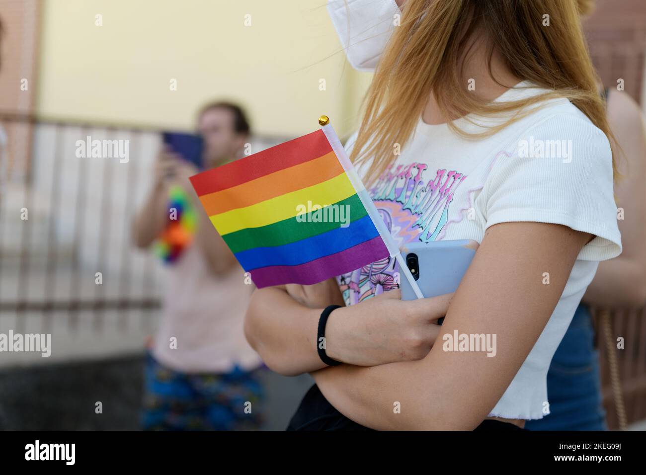 LGBT rainbow flag in a female hands close up during gay pride, close up ...