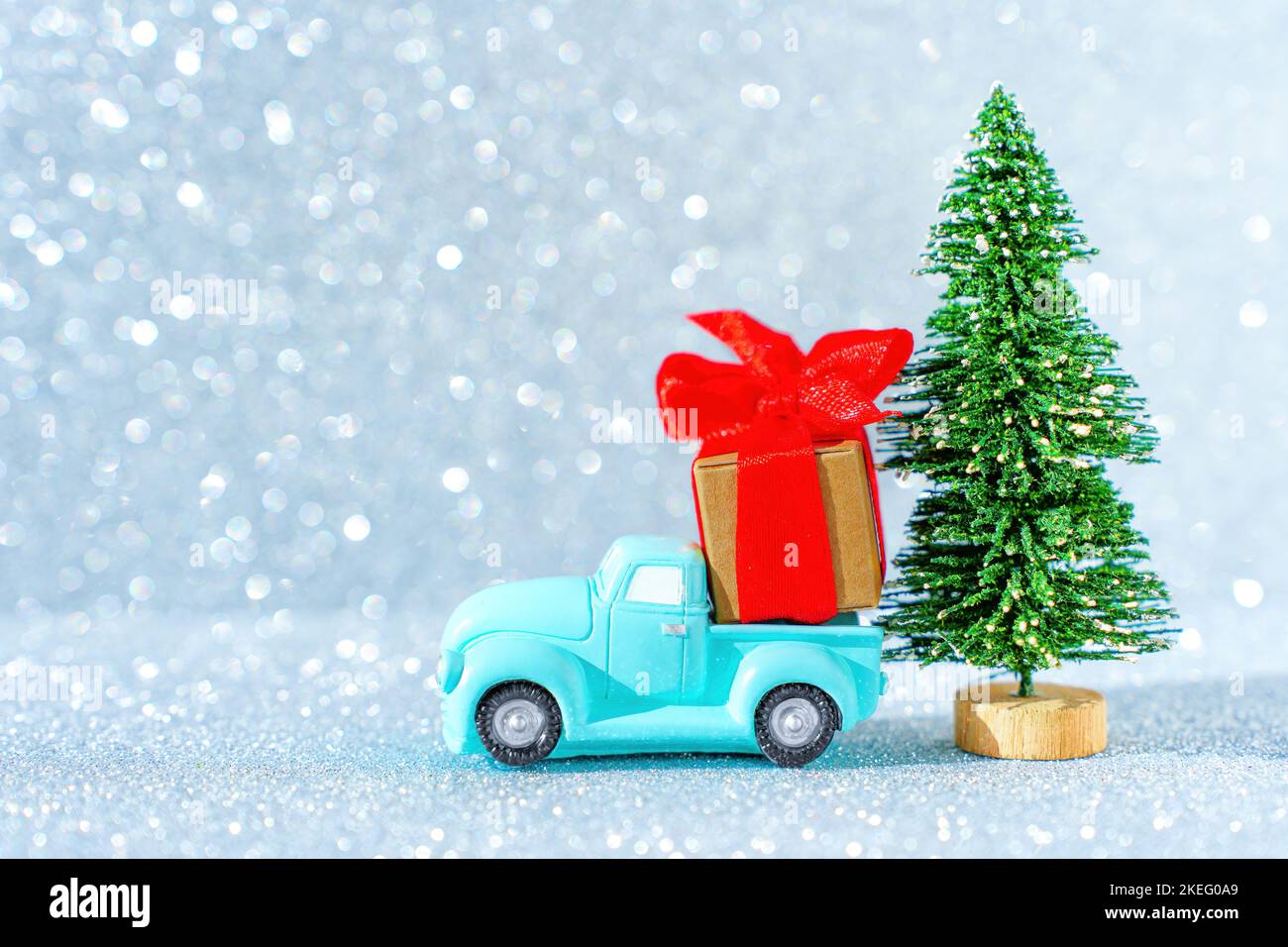 Vintage blue pickup truck with a large christmas present package parked ...