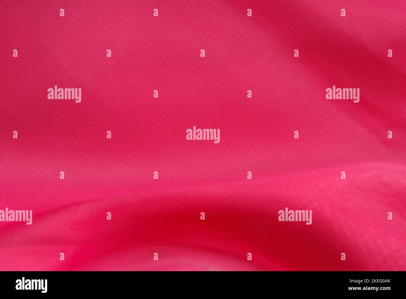 red silk fabric. wavy fabric texture Stock Photo - Alamy