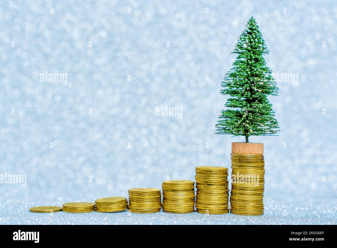 Growing winter holidays spending chart: Miniature toy Christmas tree ...