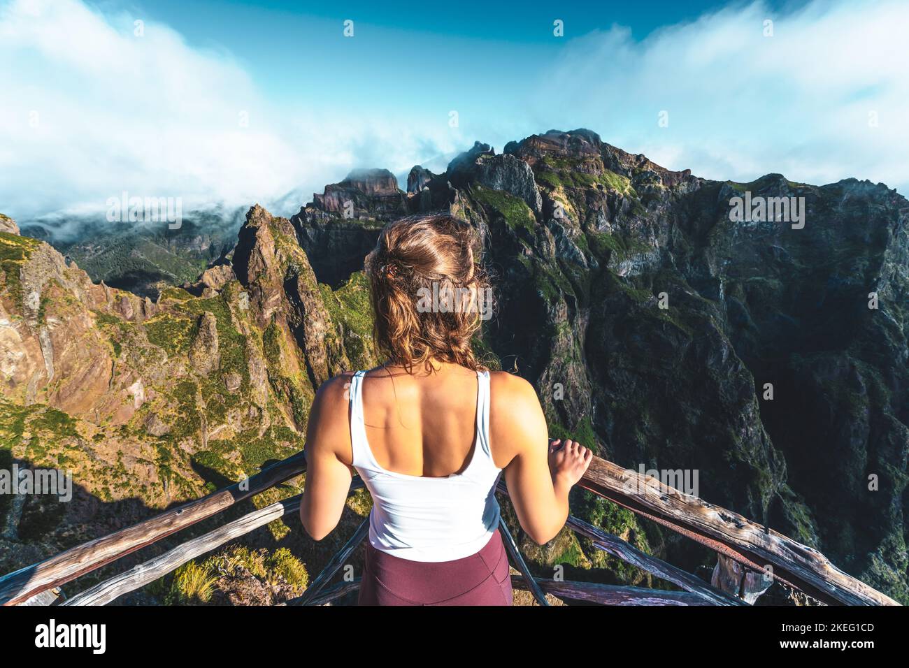 Description: Hiker enjoying the mountain scenery of Pico Ruivo from a ...