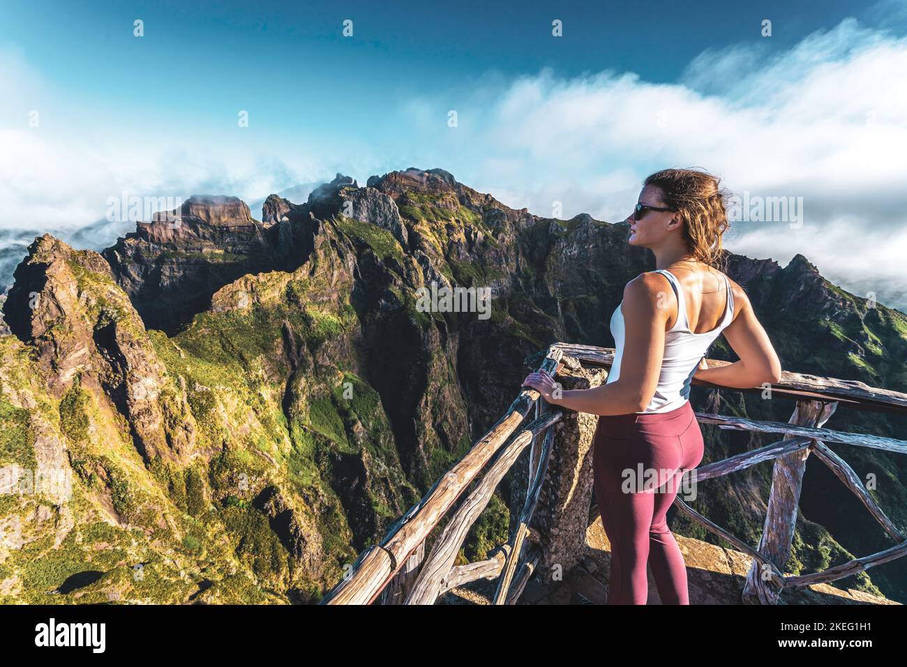 Description: Hiker enjoying the mountain scenery of Pico Ruivo from a ...