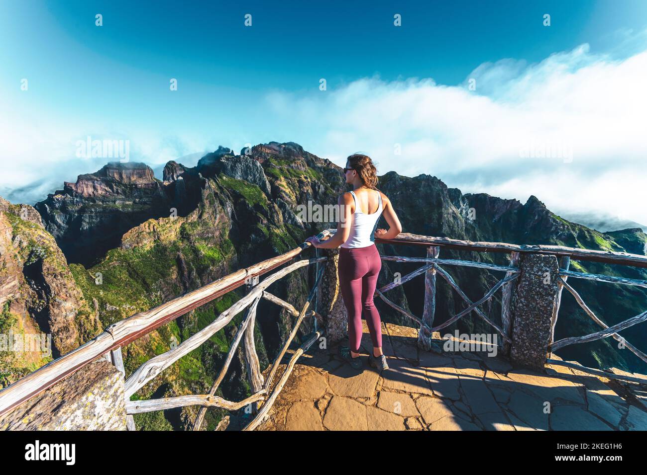 Description: Hiker enjoying the mountain scenery of Pico Ruivo from a ...