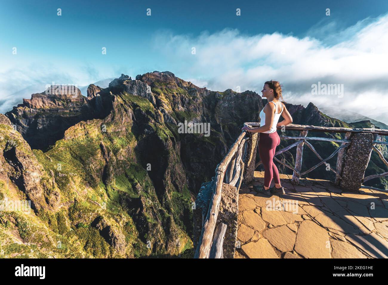 Description: Hiker enjoying the mountain scenery of Pico Ruivo from a ...