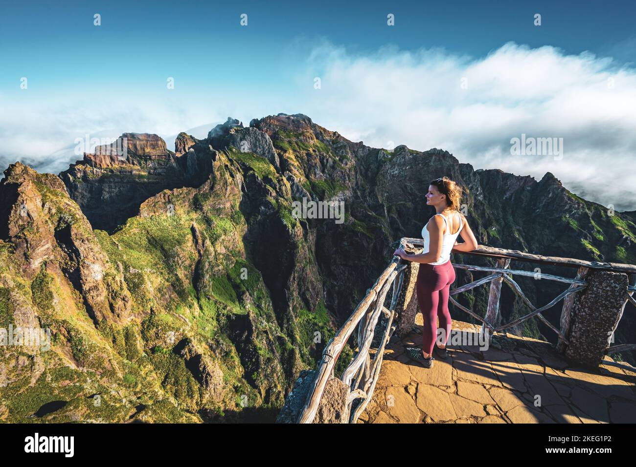 Description: Hiker enjoying the mountain scenery of Pico Ruivo from a ...