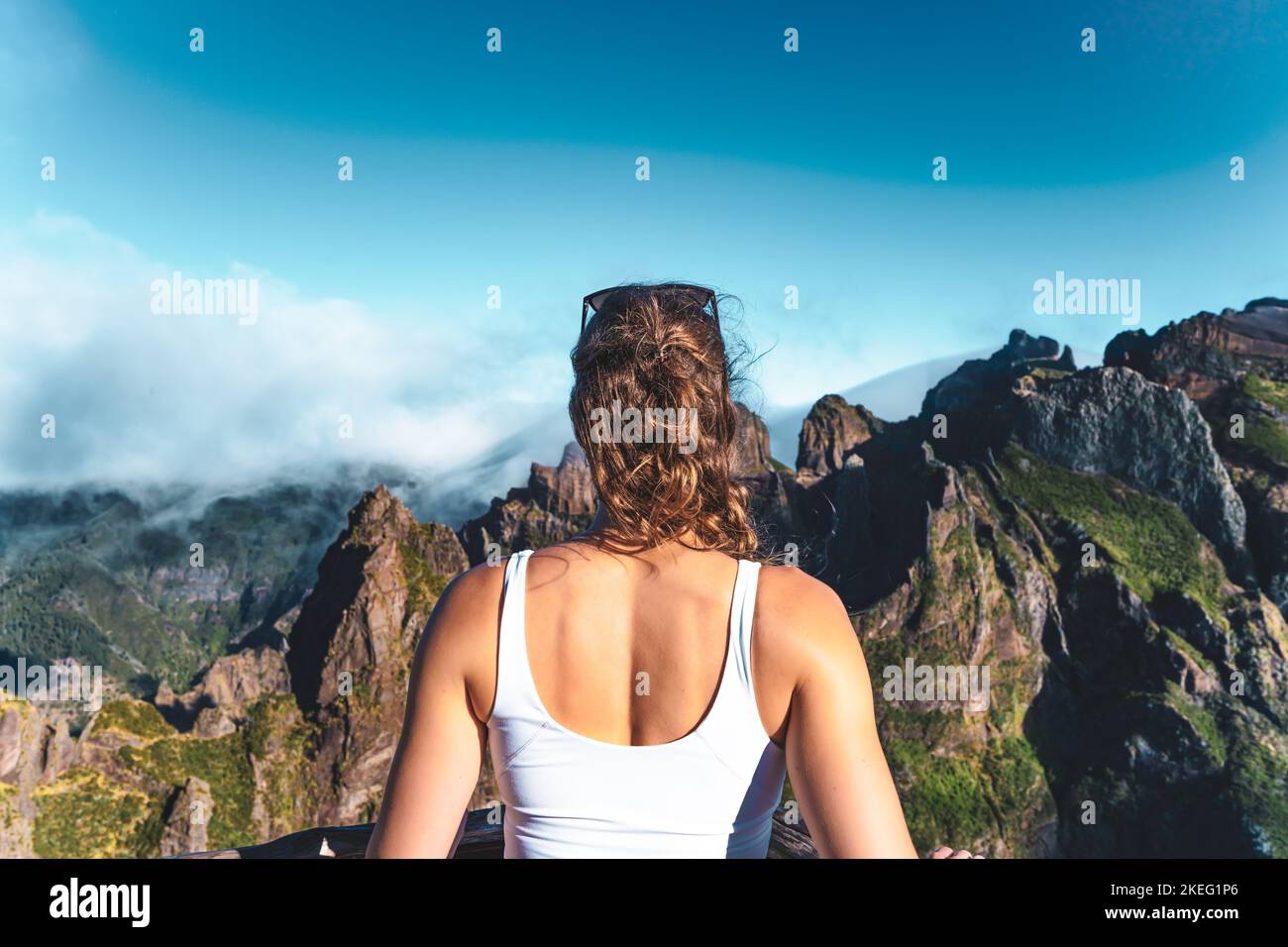 Description: Hiker enjoying the mountain scenery of Pico Ruivo from a ...