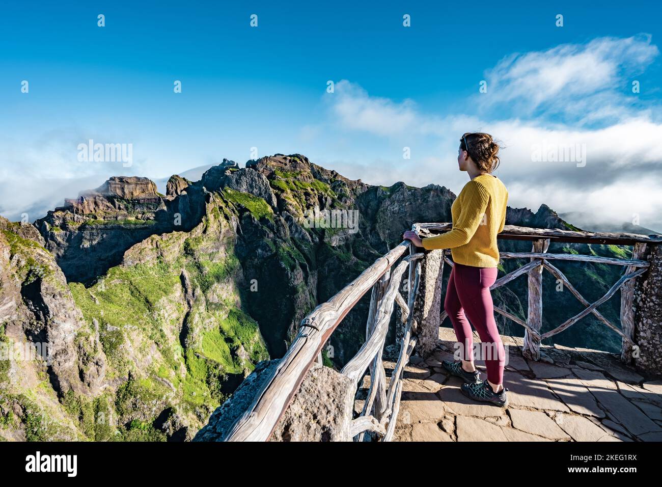 Description: Hiker enjoying the mountain scenery of Pico Ruivo from a ...