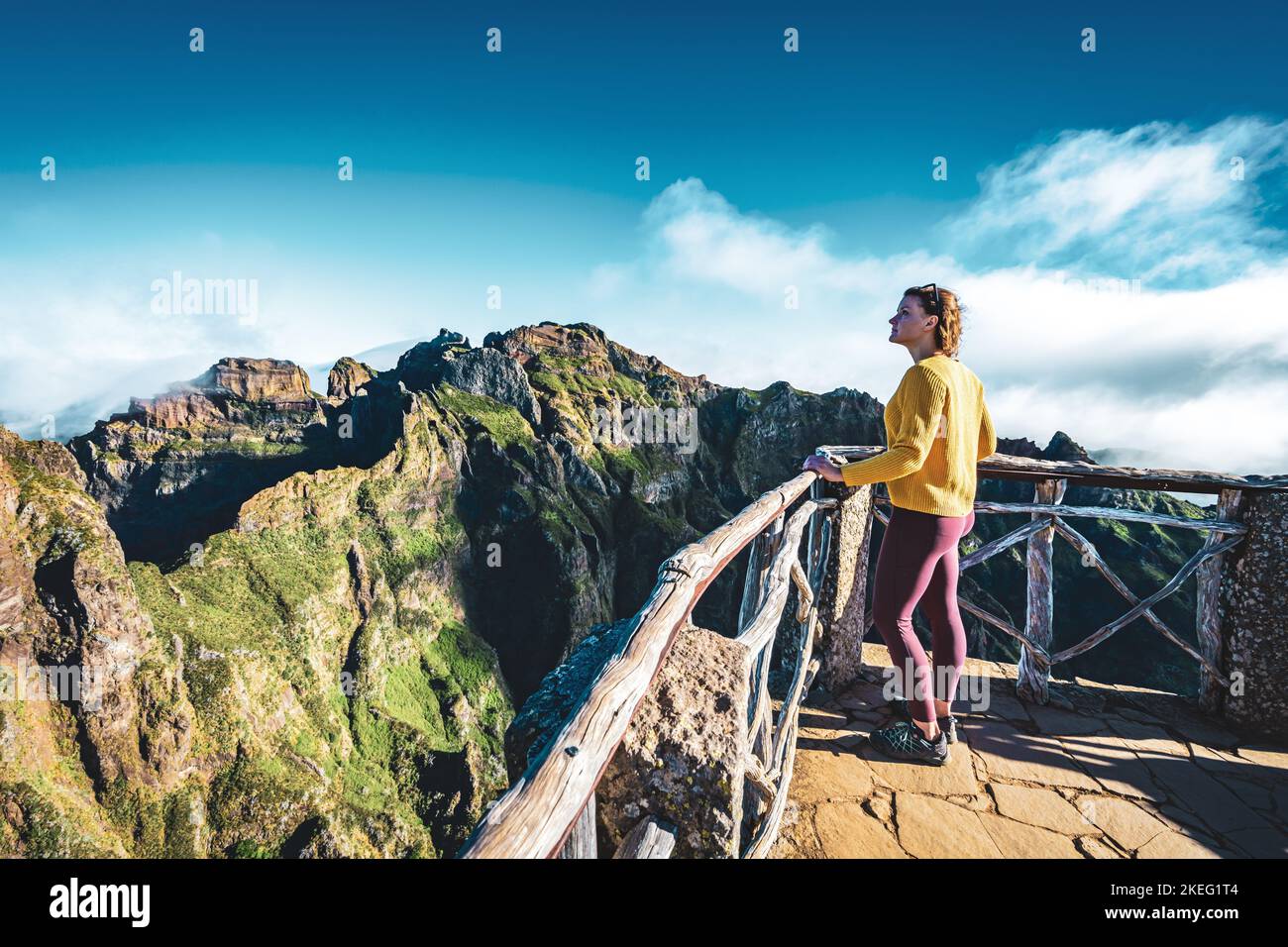 Description: Hiker enjoying the mountain scenery of Pico Ruivo from a ...