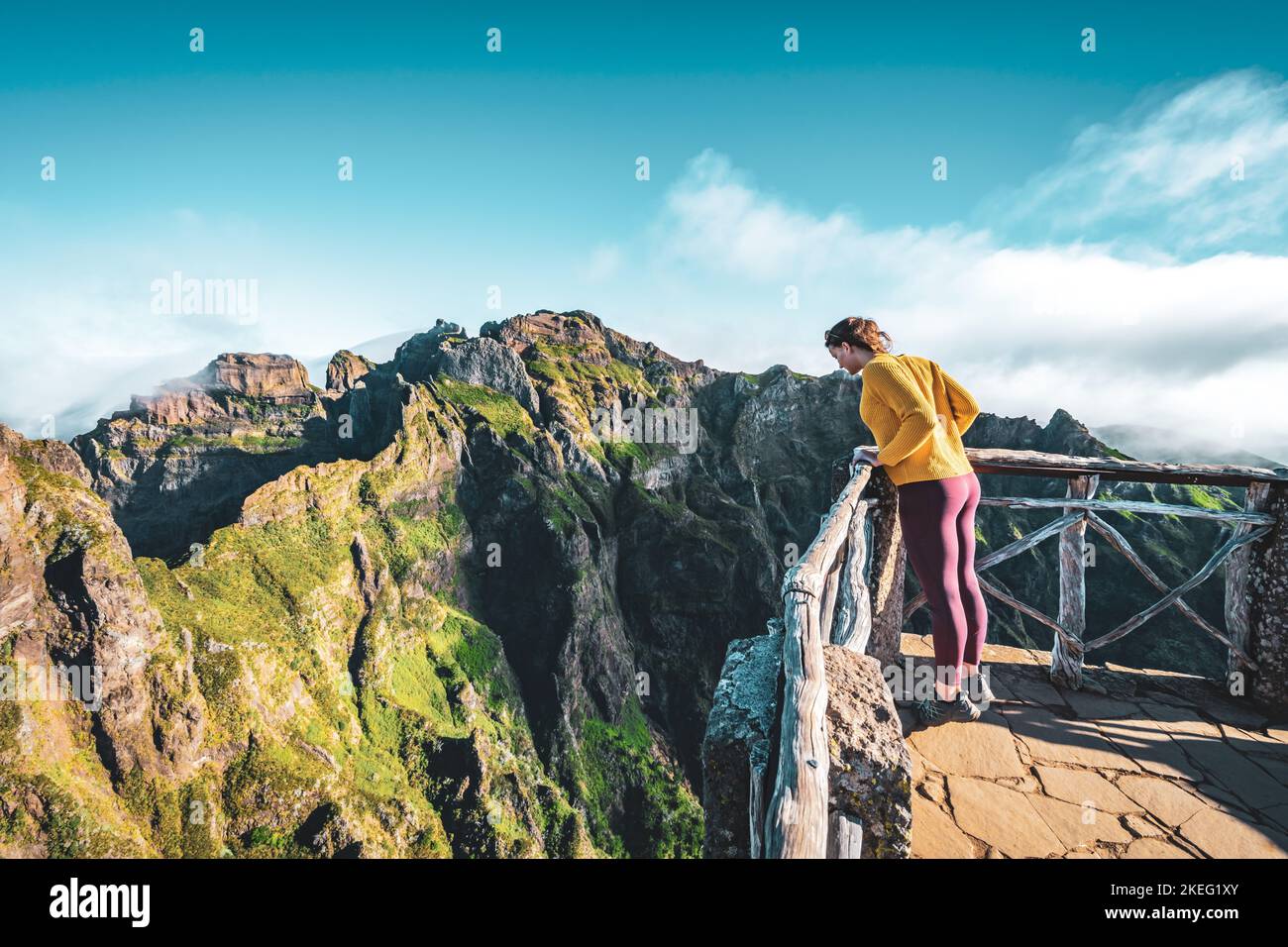 Description: Hiker enjoying the mountain scenery of Pico Ruivo from a ...