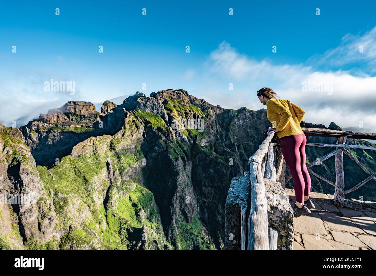 Description: Hiker enjoying the mountain scenery of Pico Ruivo from a ...
