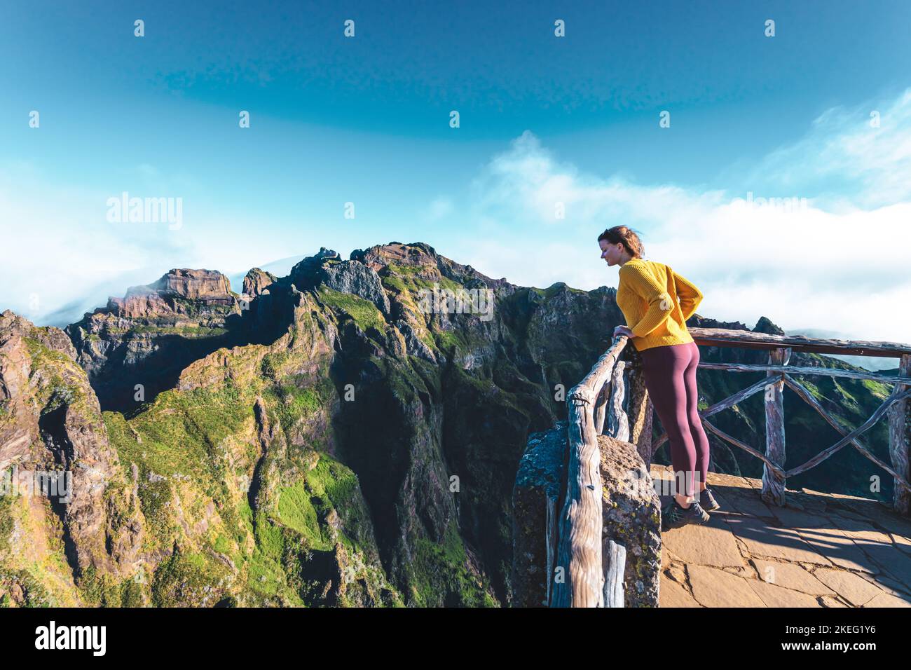Description: Hiker enjoying the mountain scenery of Pico Ruivo from a ...
