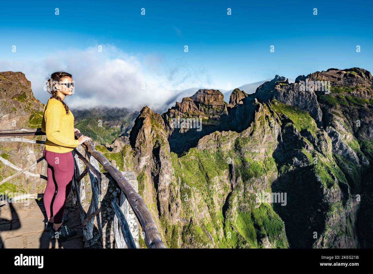 Description: Hiker enjoying the mountain scenery of Pico Ruivo from a ...