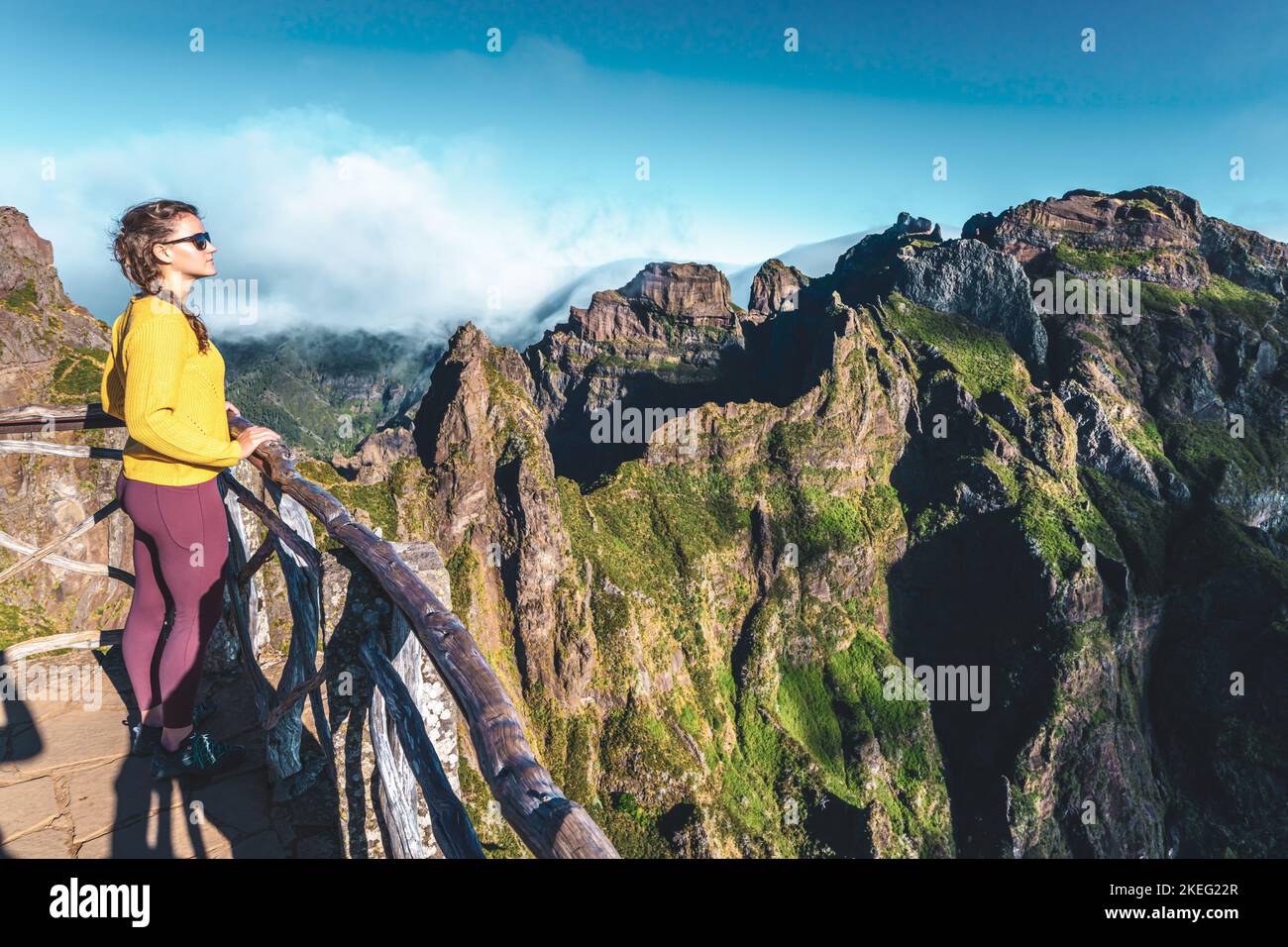 Description: Hiker enjoying the mountain scenery of Pico Ruivo from a ...