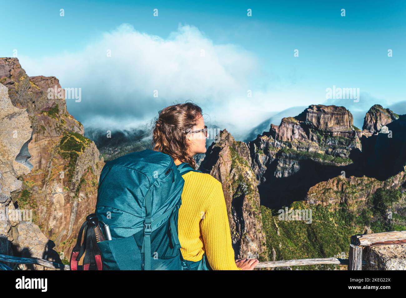 Description: Hiker enjoying the mountain scenery of Pico Ruivo from a ...