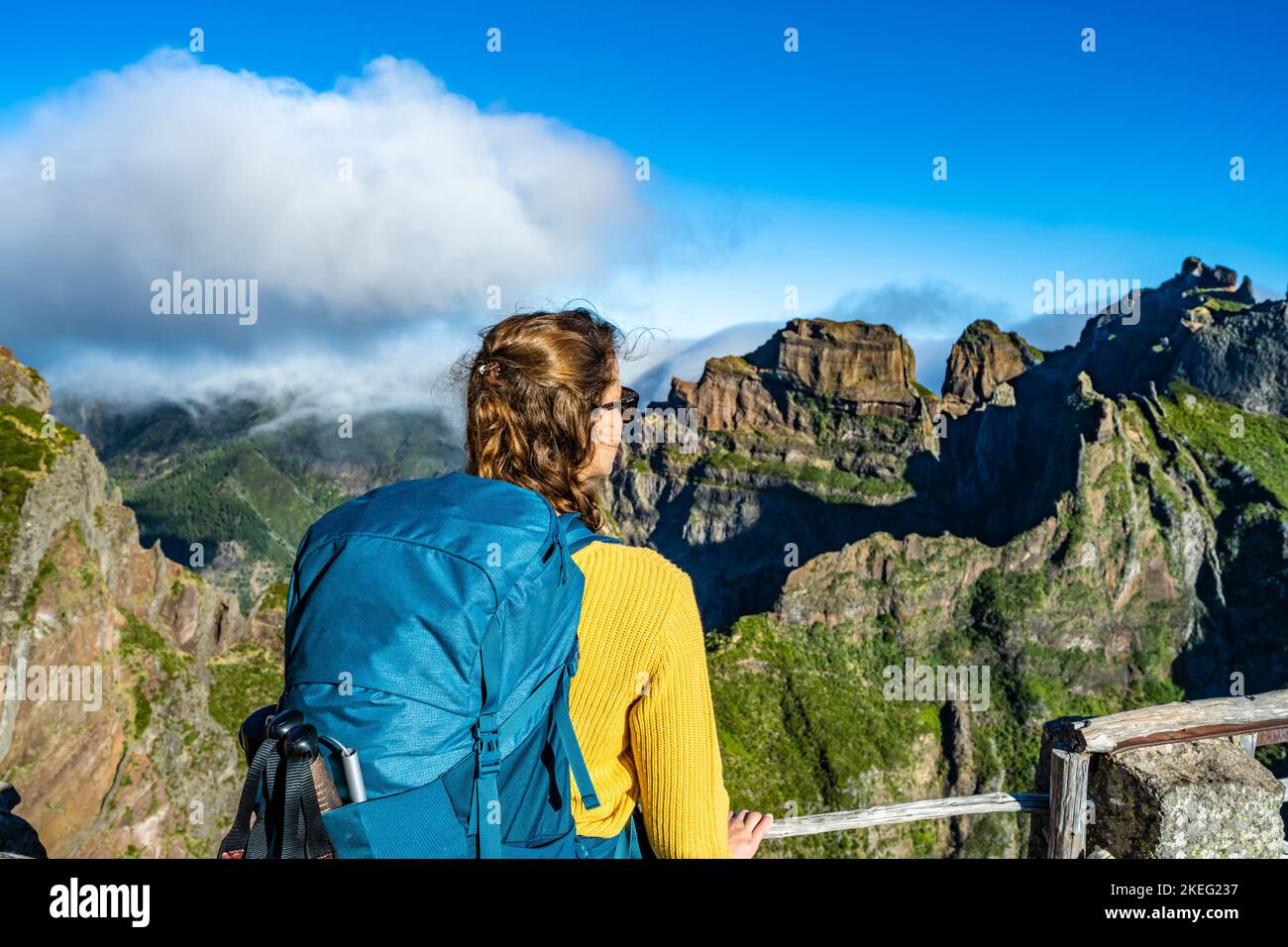 Description: Hiker enjoying the mountain scenery of Pico Ruivo from a ...