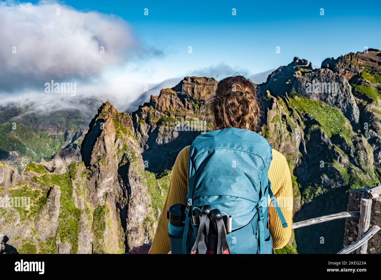 Description: Hiker enjoying the mountain scenery of Pico Ruivo from a ...