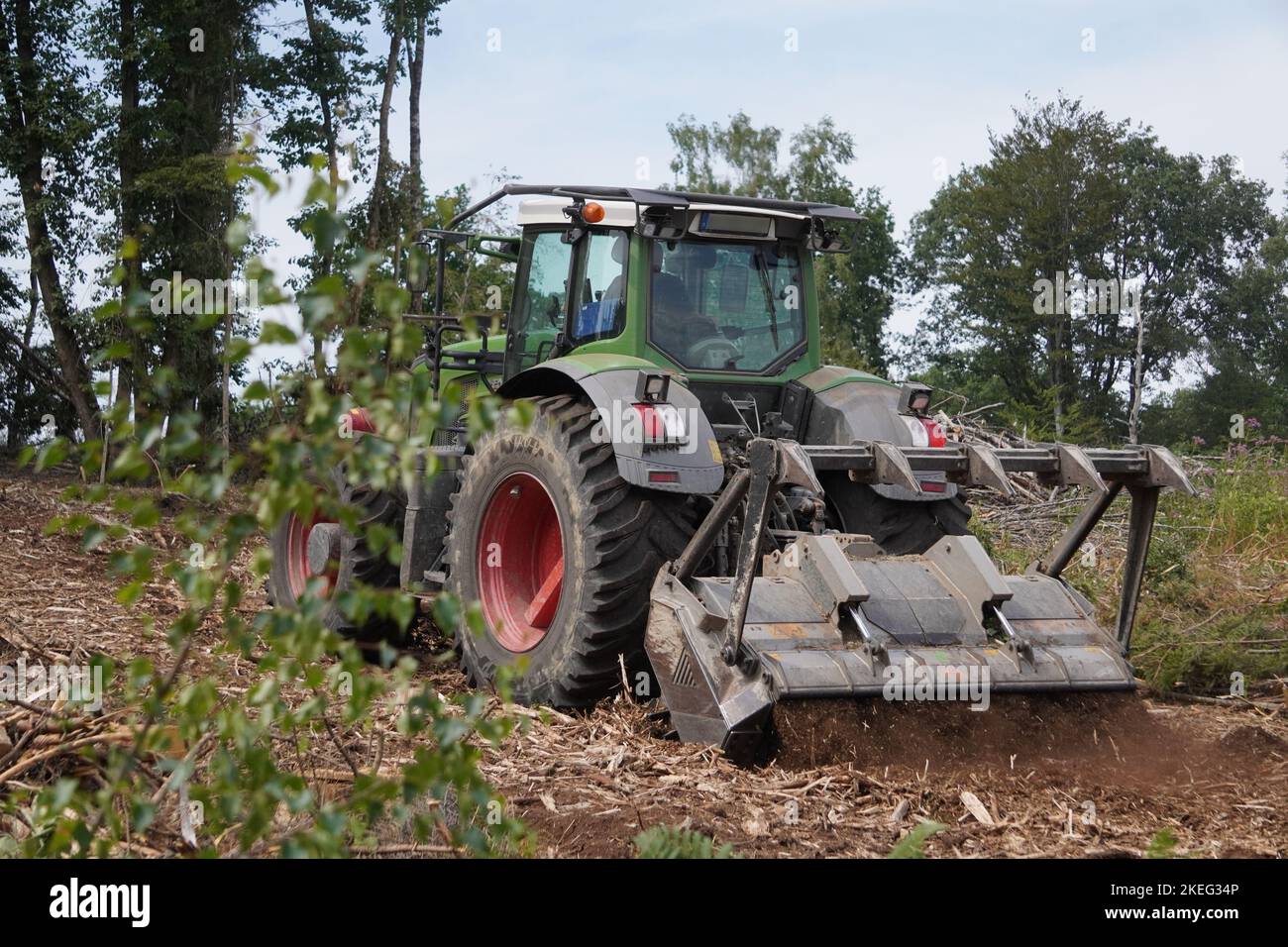 A tractor on a trail in a forest Stock Photo - Alamy