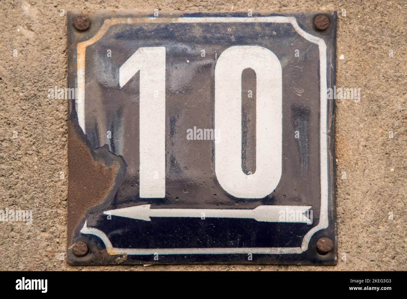 Weathered grunge square metal enameled plate of number of street ...