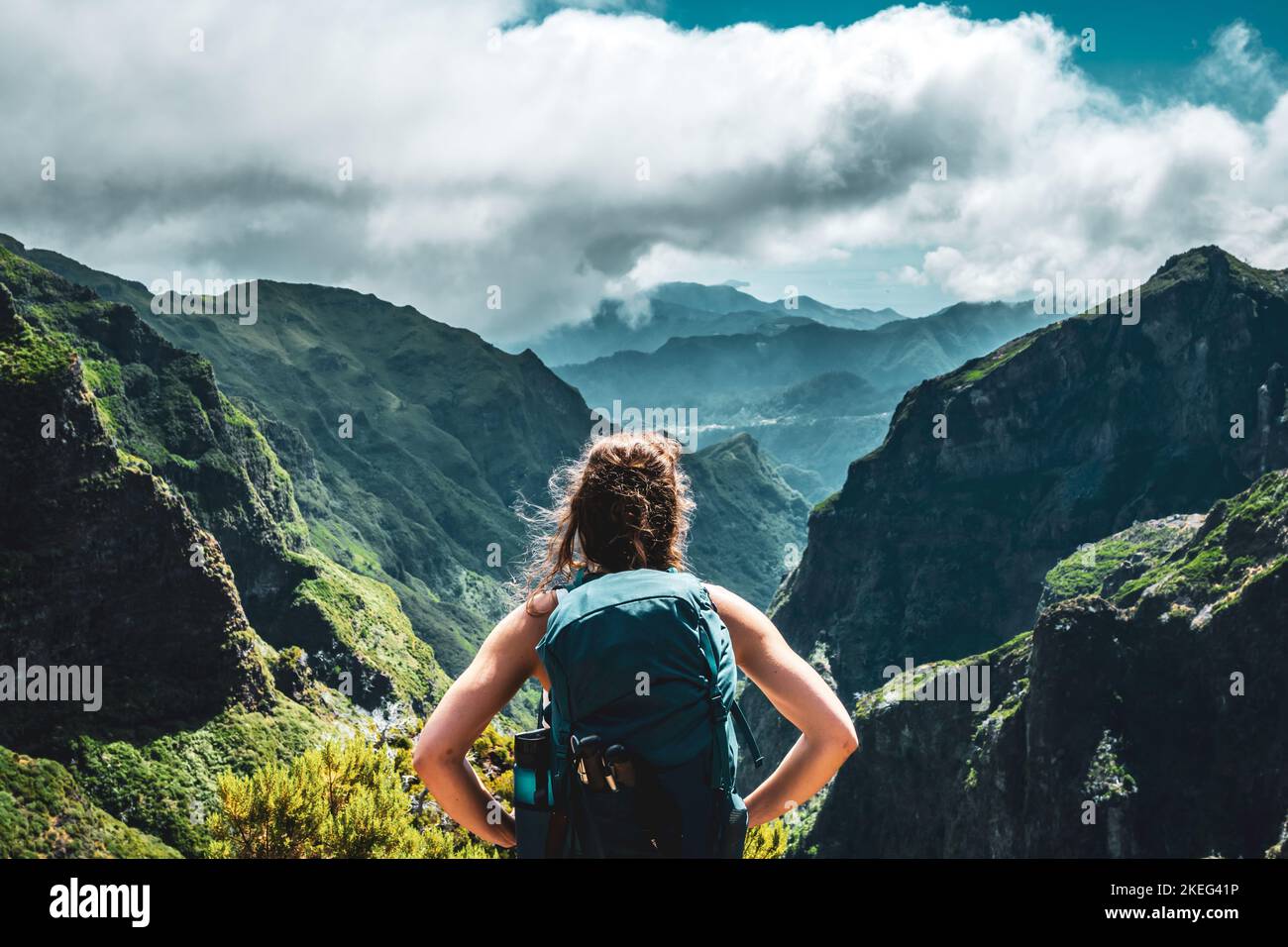 Description: Woman enjoying mountain scenery from very scenic view ...