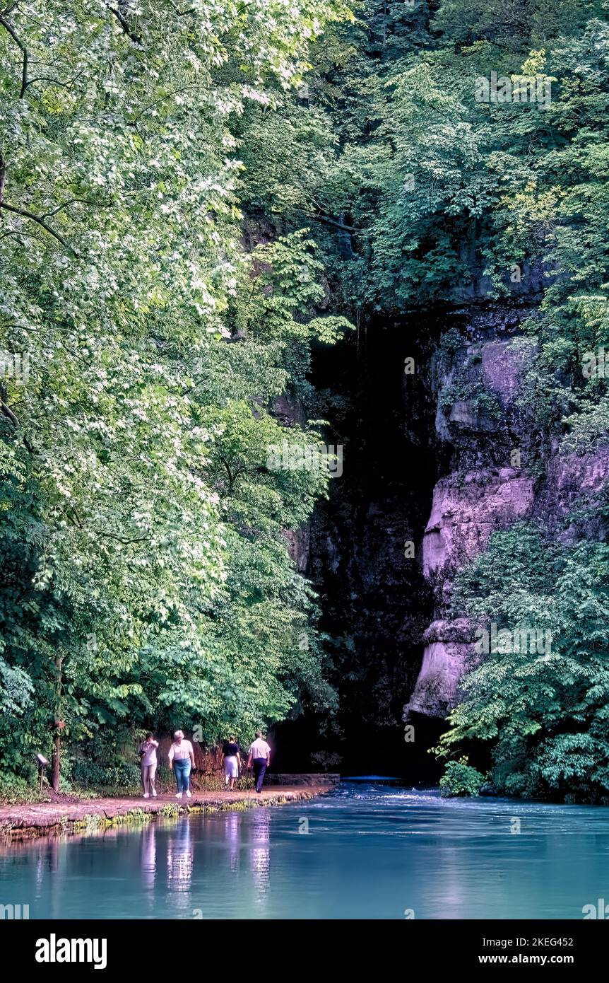 Water flows from a chasm between two bluffs at Roaring River State Park ...