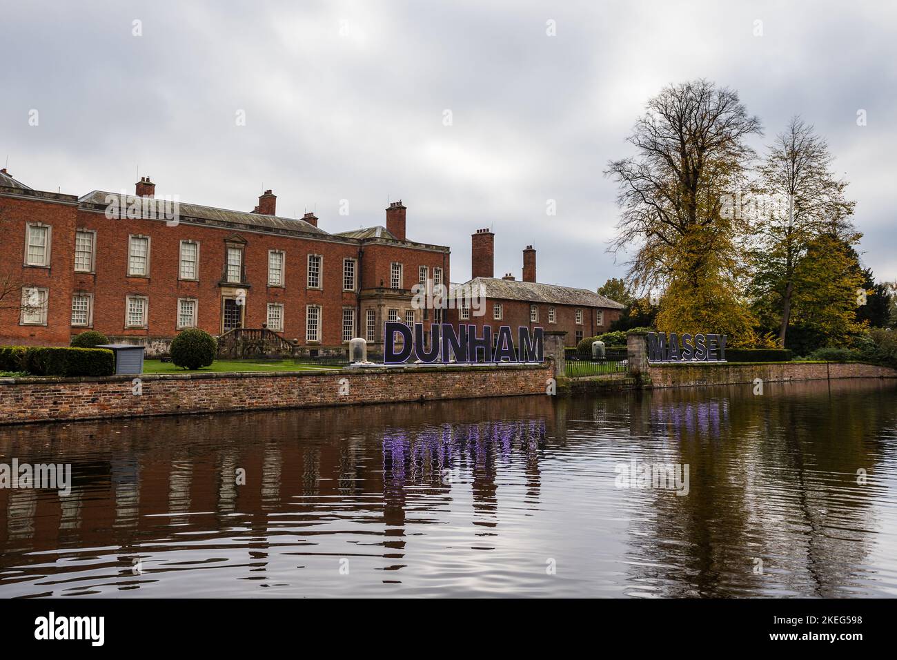 Dunham Massey Hall and Gardens reflecting in the lake with an ...