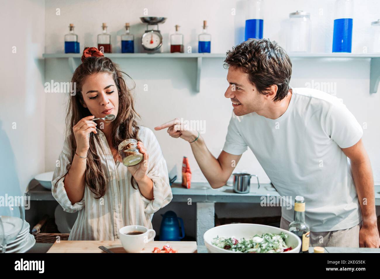 Girlfriend got caught eating desert by her boyfriend Stock Photo - Alamy