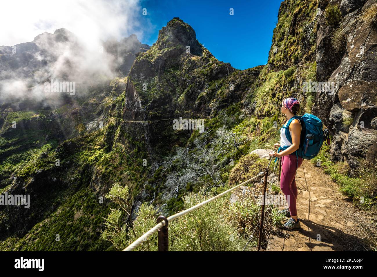 Description: Hiker with backpack enjoying the view along very scenic ...