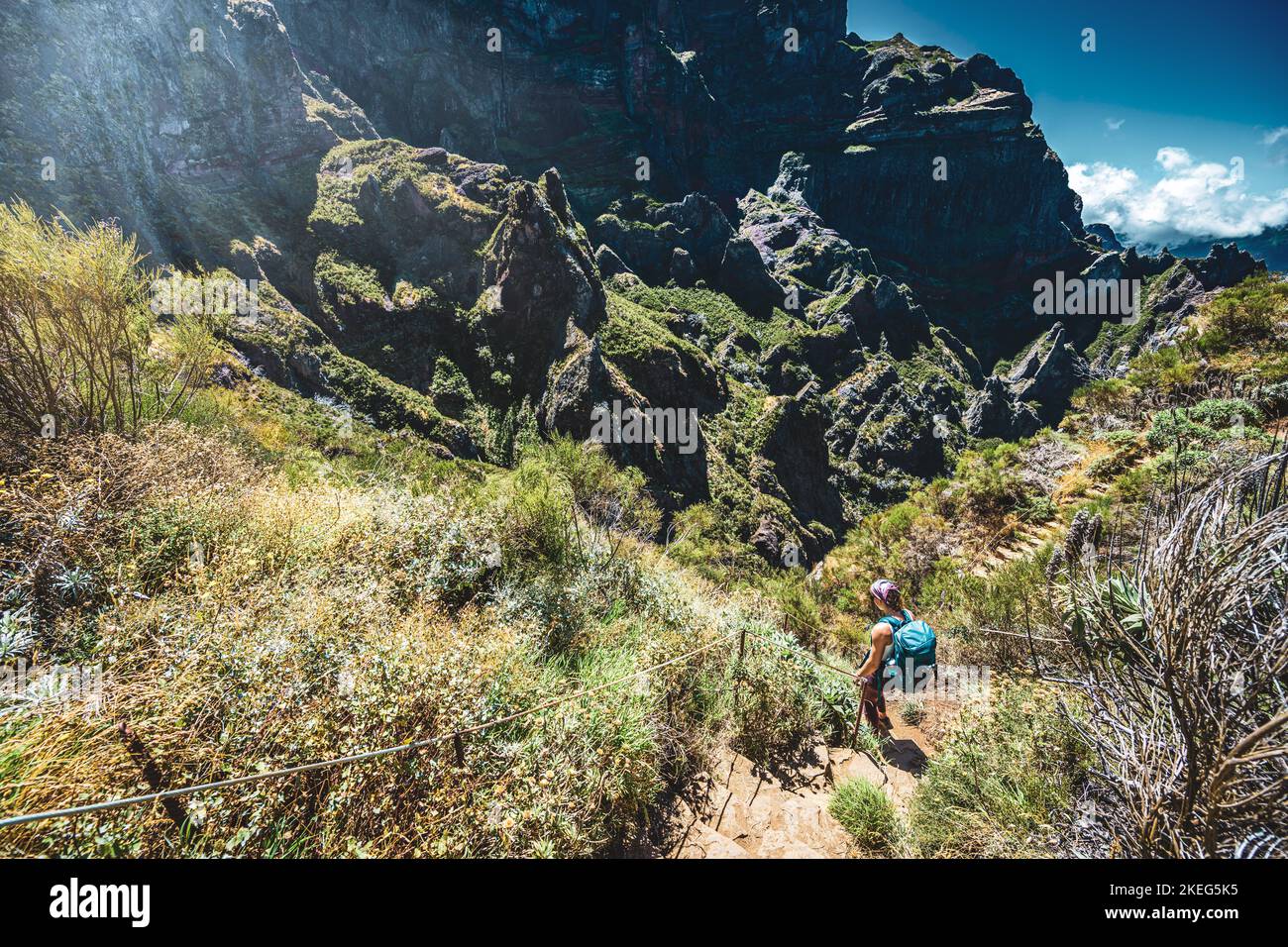 Hiker with backpack walking along very scenic hike trail to Pico do ...