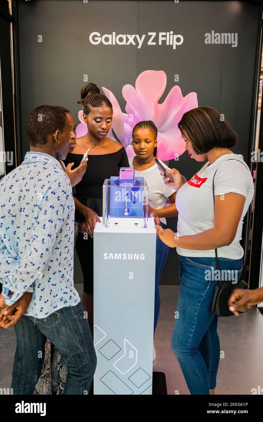 The Customers viewing Samsung phones at mall pop-up retail stand Stock ...
