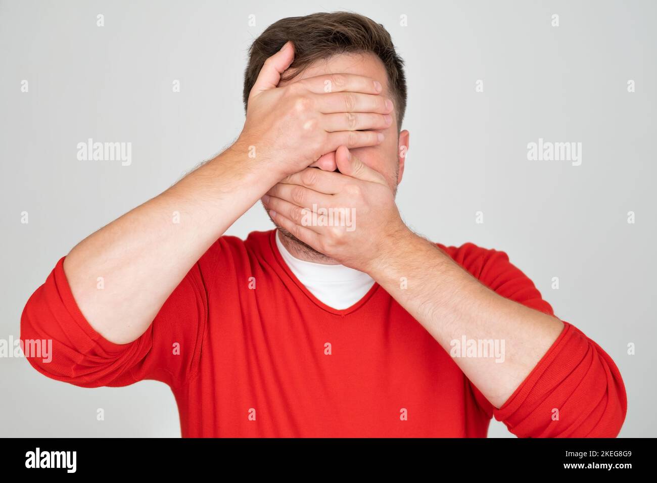 Person trying to hide face with hand hi-res stock photography and ...