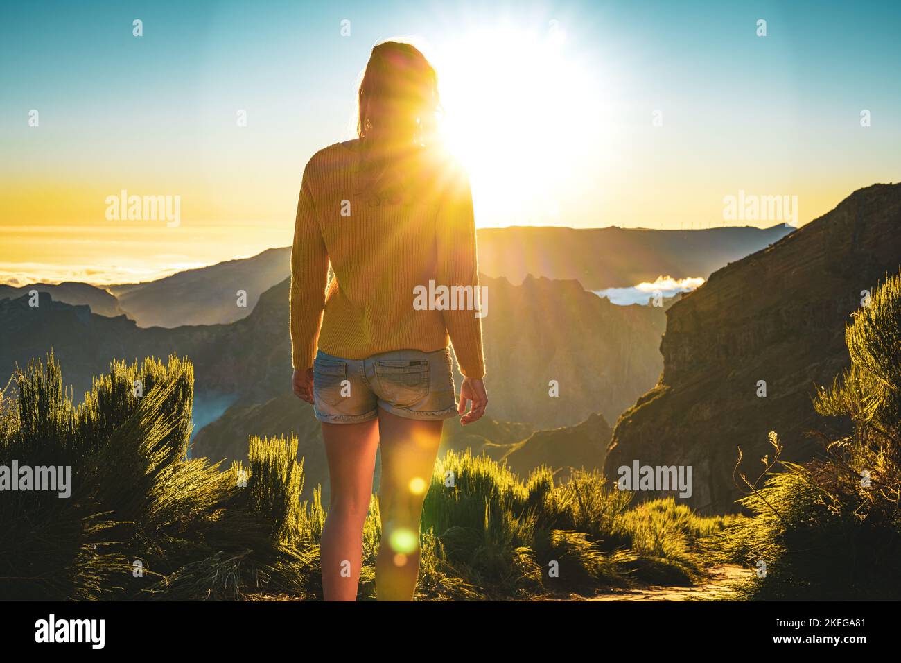 Description: Sporty woman walking barefoot in the evening sun on Pico ...