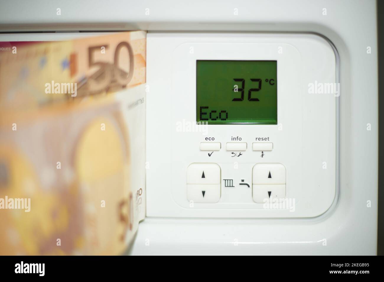 Euro Bills On The Door Of The Heating Boiler With Digits Of The Temperature Of The Thermostat