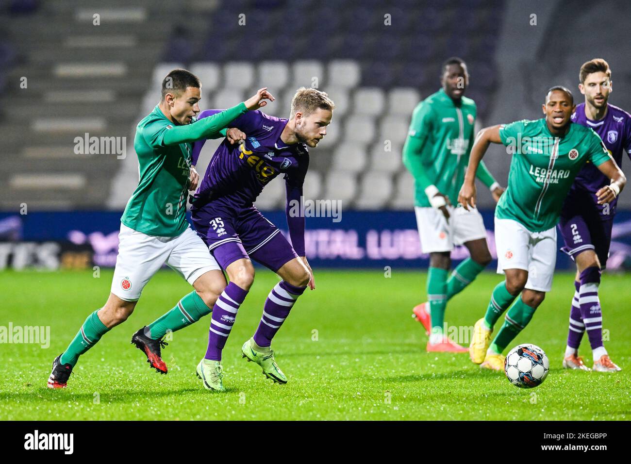 Virton's Maxime Guillaume and Beerschot's Dante Rigo pictured in action ...