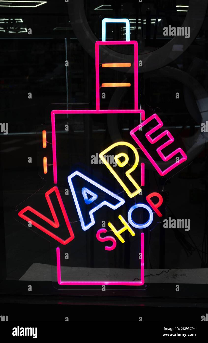 Neon sign in UK vape shop window Stock Photo - Alamy
