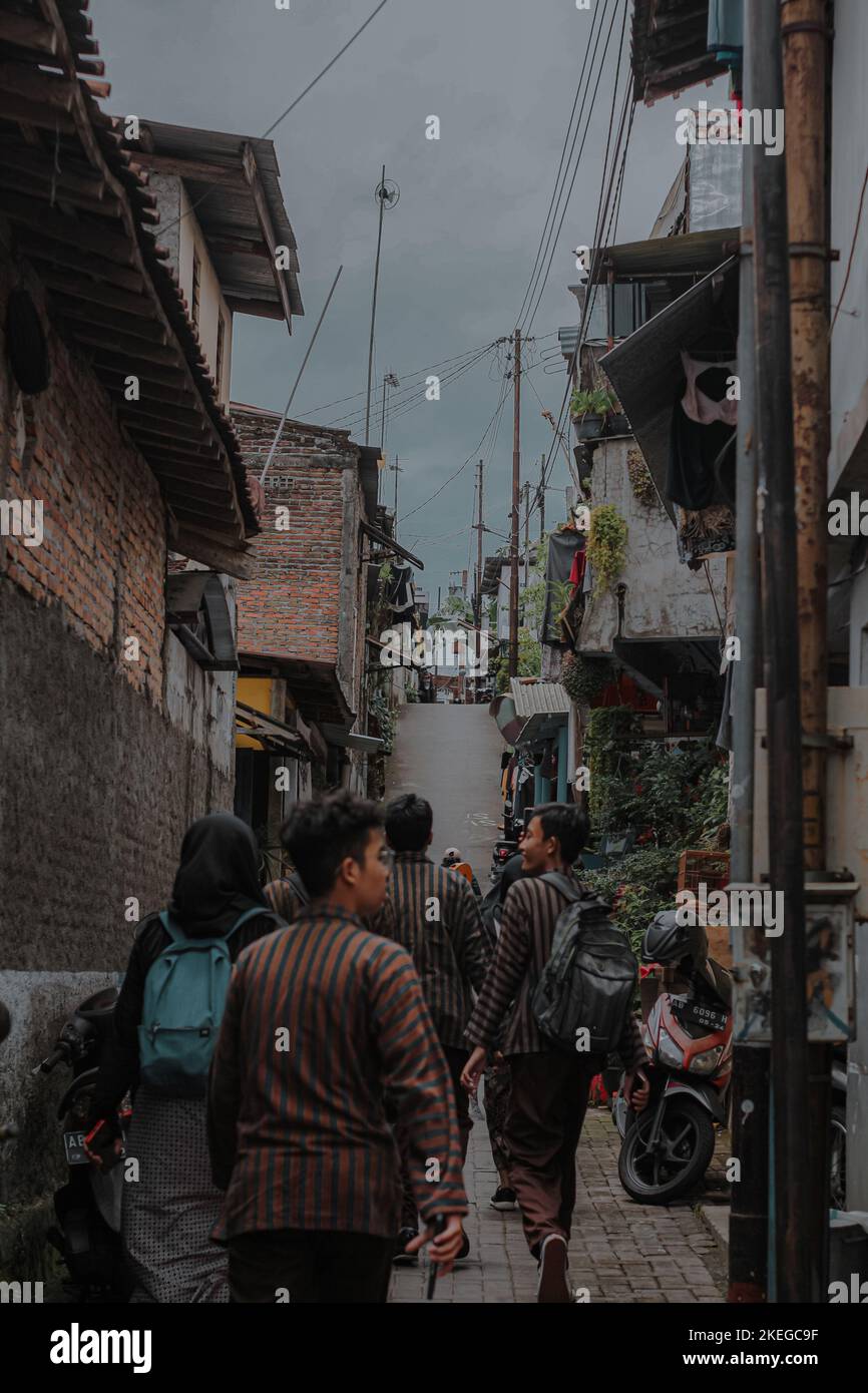 A vertical shot of the street in Yogyakarta, Indonesia, with people ...