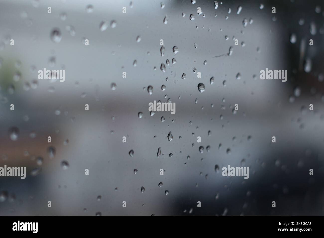 A view of the window covered with raindrops and fog, suitable for ...