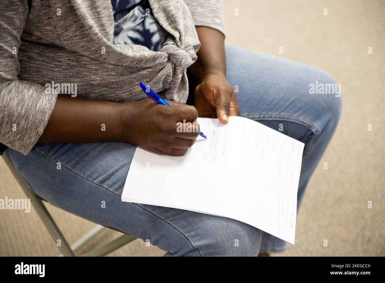 A person taking notes during first aid training Stock Photo - Alamy
