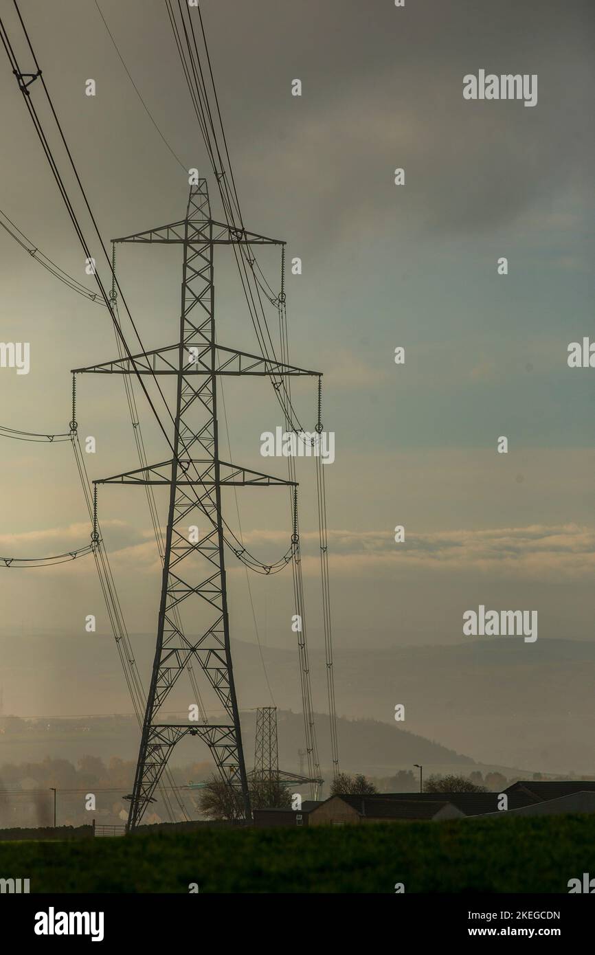 Pylons on a Pennine hillside at dawn near Halifax, West Yorkshire, UK ...