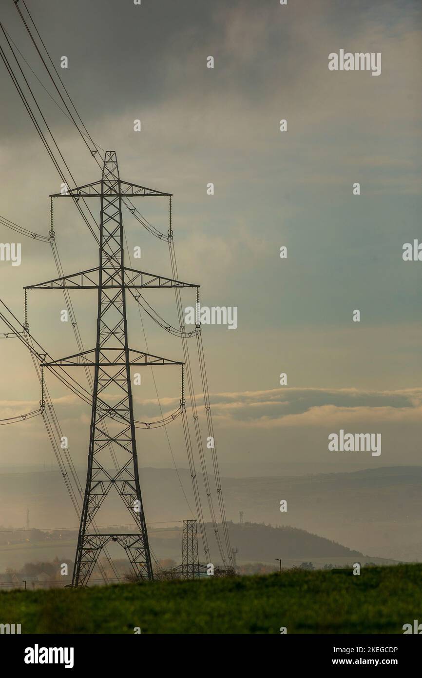 Pylons on a Pennine hillside at dawn near Halifax, West Yorkshire, UK ...