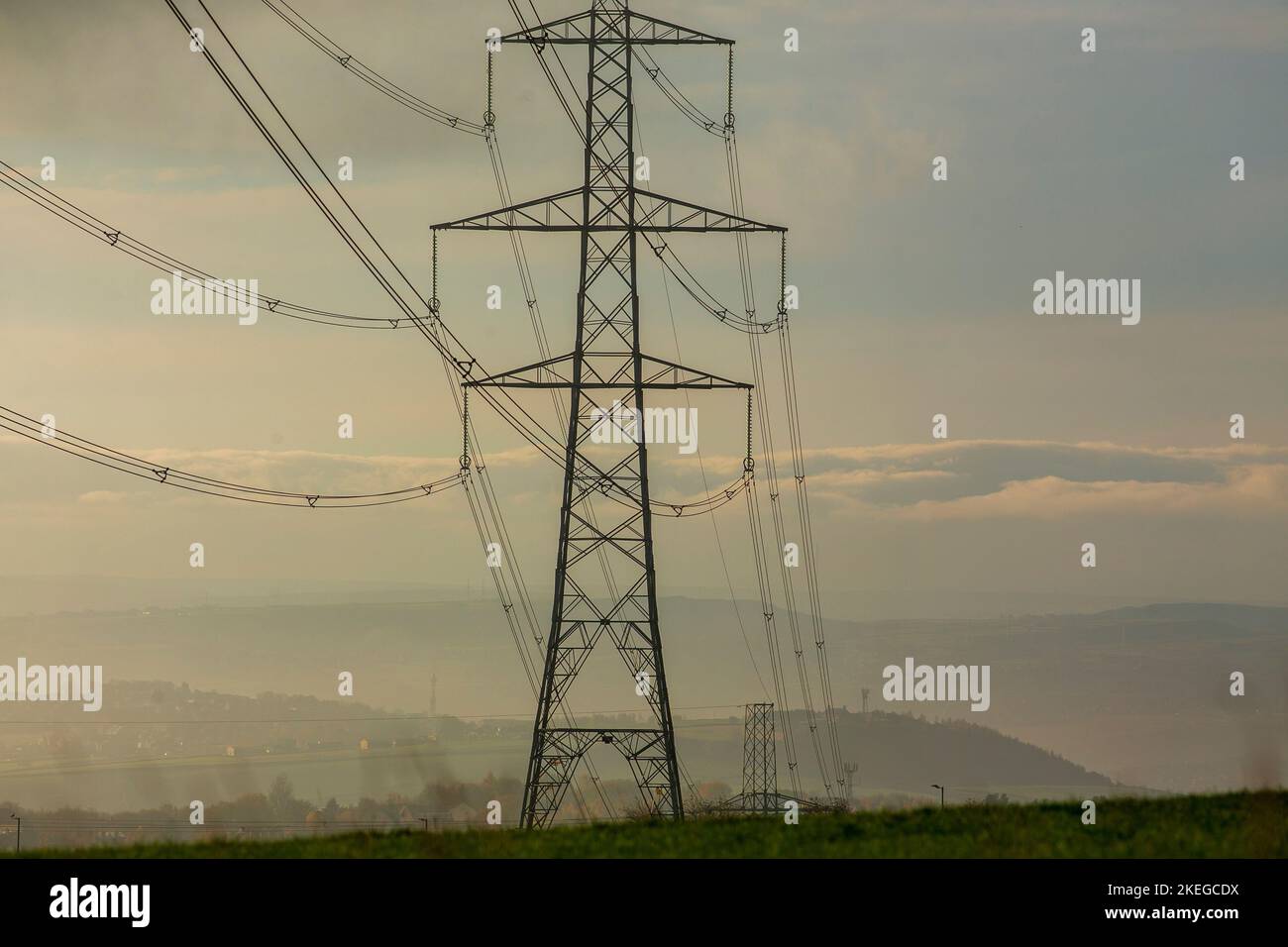Pylons on a Pennine hillside at dawn near Halifax, West Yorkshire, UK ...