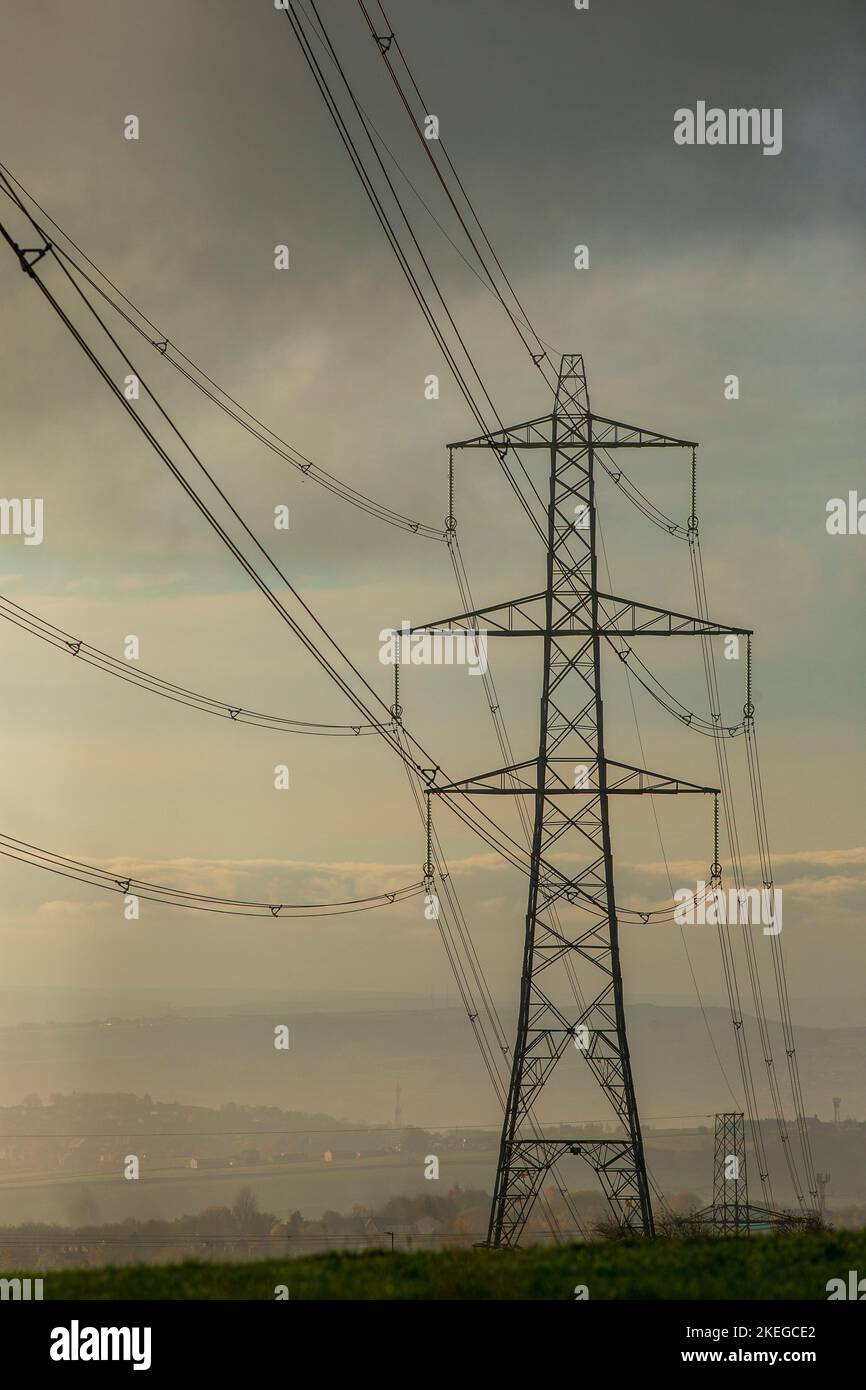 Pylons on a Pennine hillside at dawn near Halifax, West Yorkshire, UK ...