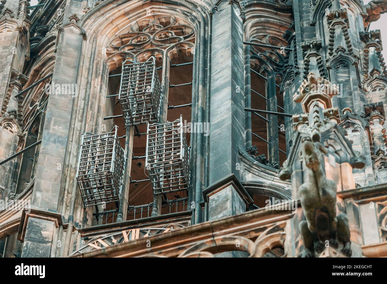 Intimidating cages for prisoners on the facade at a height in the ...