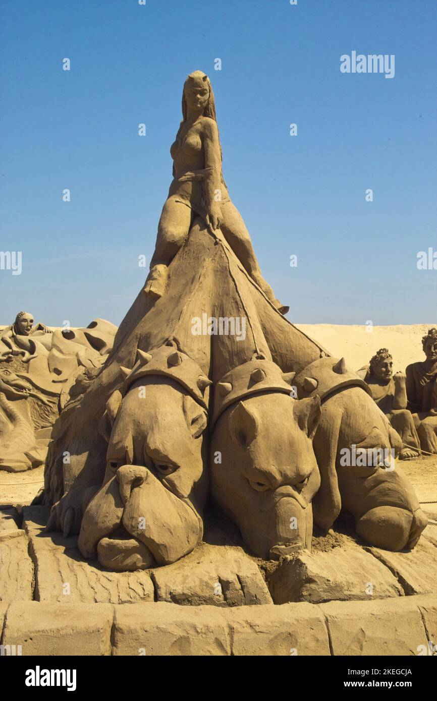 Closeup view of a sand figure of a woman sitting on Cerberus, the ...