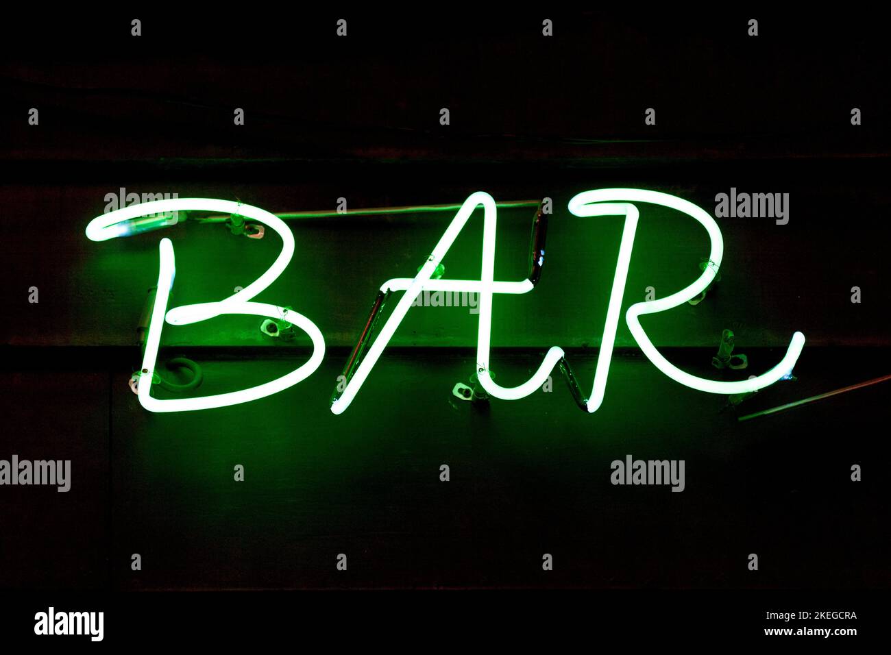Close-up on a green neon light shaped into the word - Bar Stock Photo ...