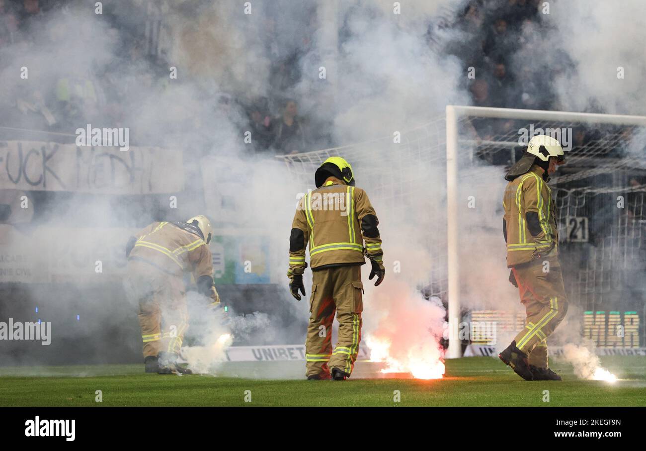Fire fighters pictured after supporters thrown fireworks to stop the ...