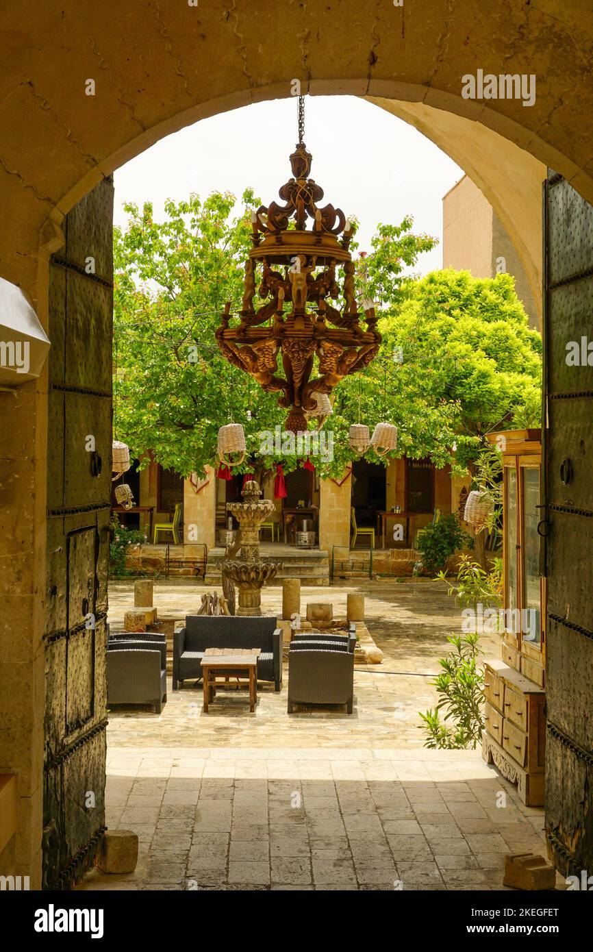 A vertical shot of a vintage chandelier in historical Geluske Han in ...
